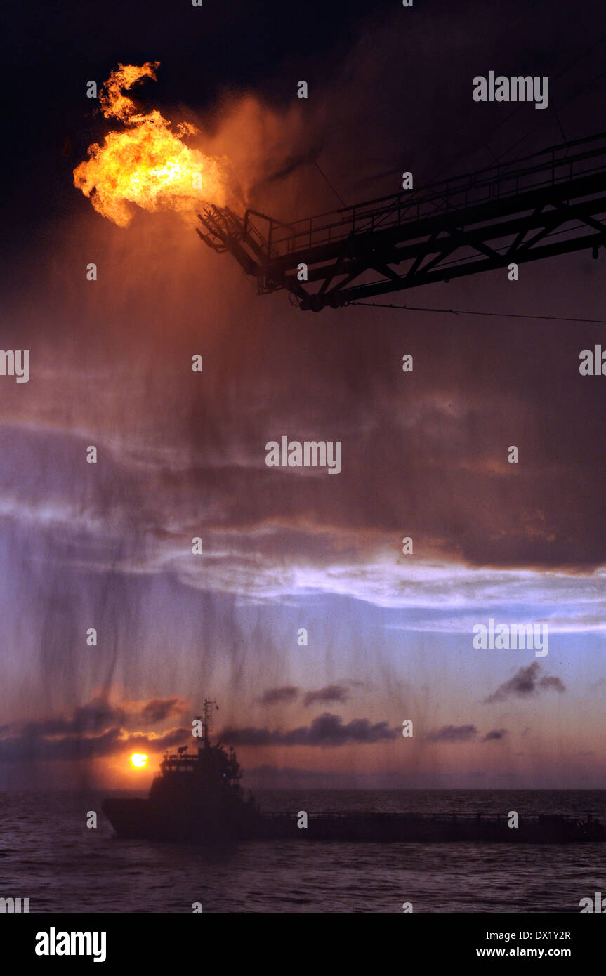 Gas from the damaged Deepwater Horizon oil well is burned off by the ...