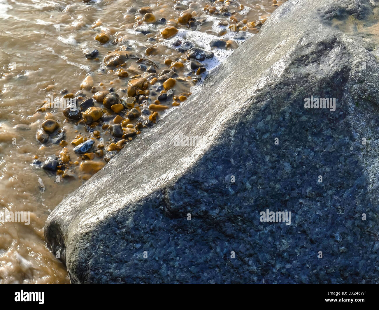 Big stone on the beach, UK Stock Photo - Alamy