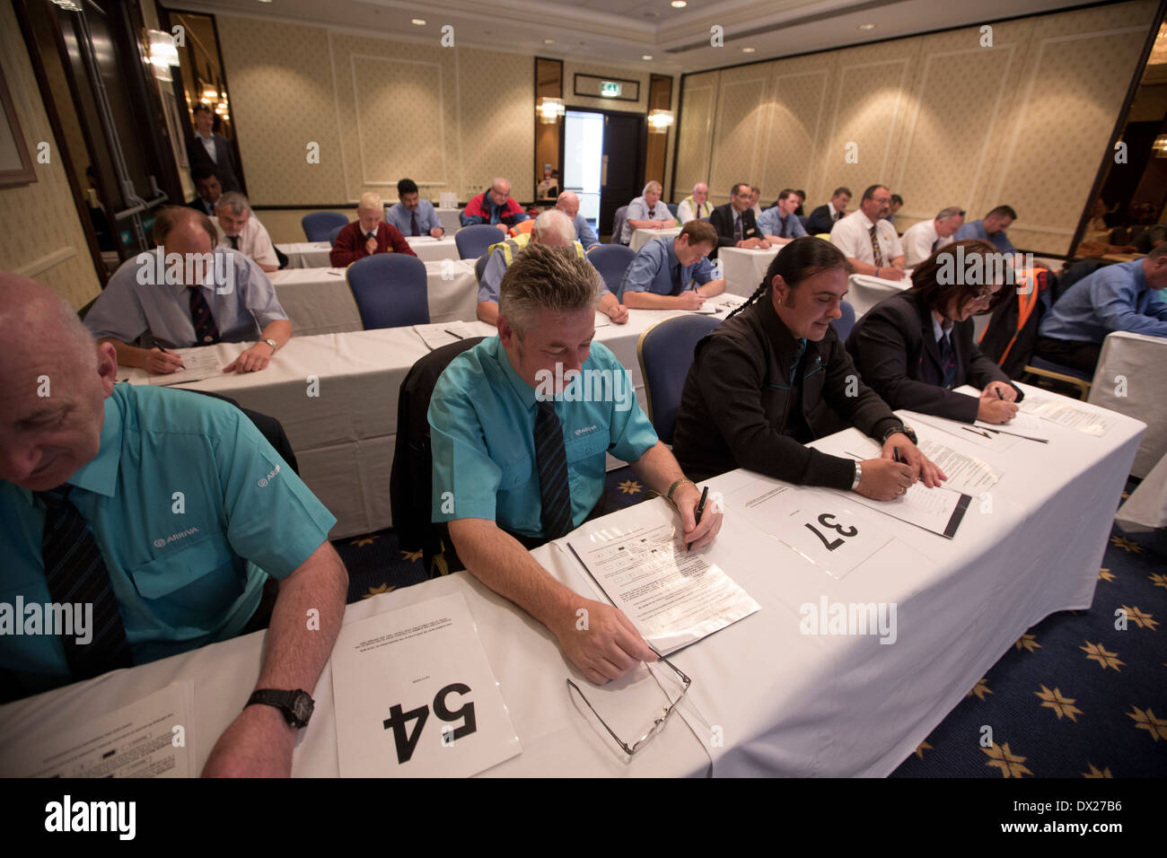Competitors undertaking a theory test during the Bus Driver of the Year ...