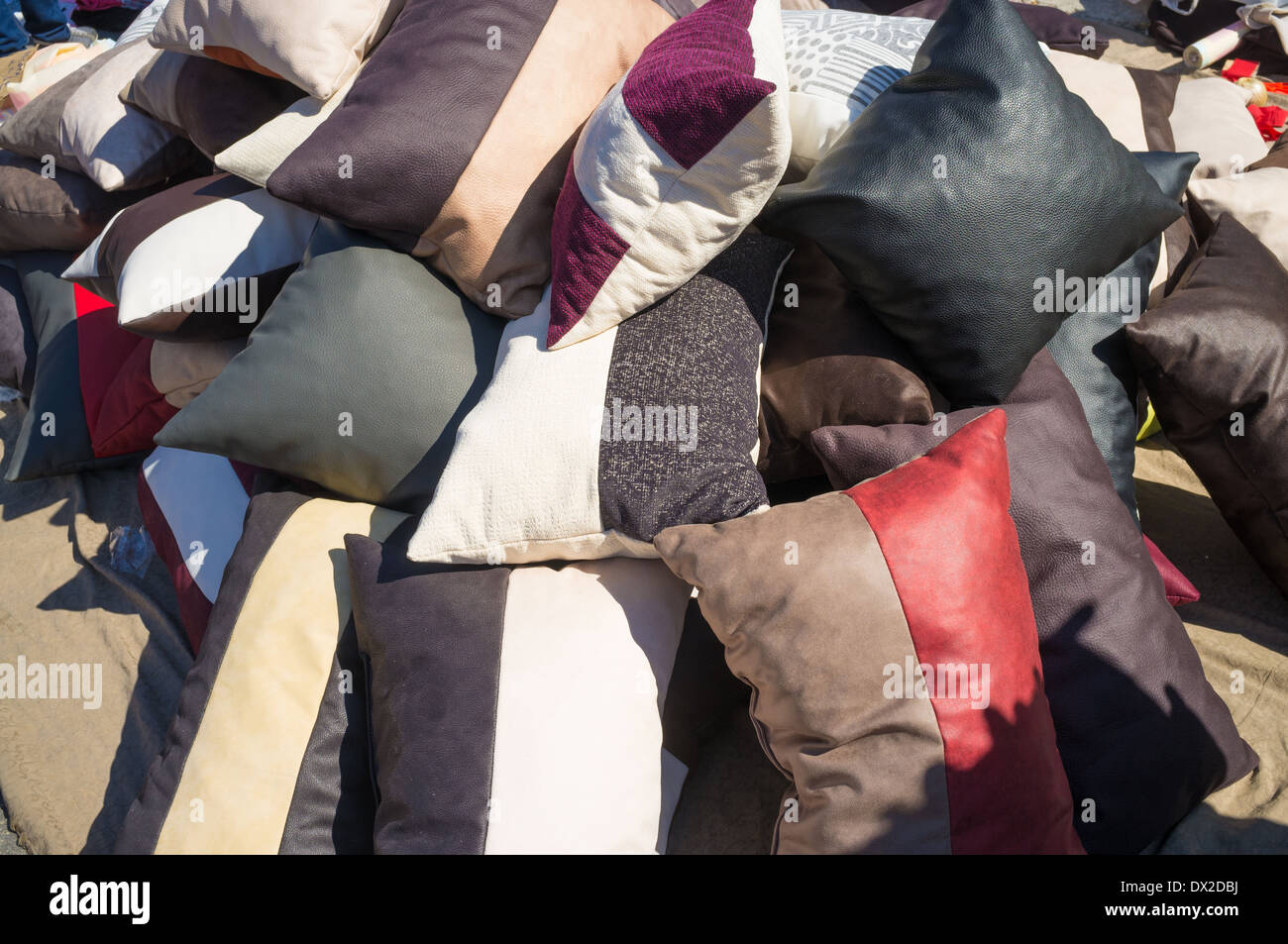 A huge stack of cushions for sale on a street market stall Stock Photo ...