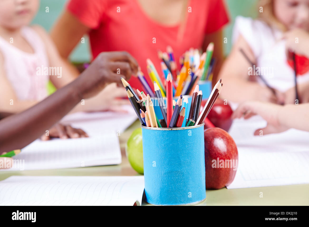 Kids Drawing With Crayons At A Table High Resolution Stock Photography ...