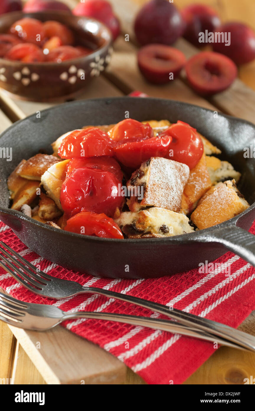 Kaiserschmarren. Shredded pancake dessert with plum compote Stock Photo ...