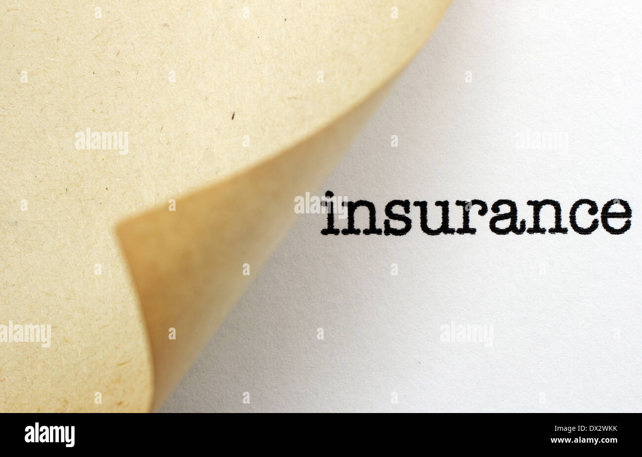 Insurance text behind paper Stock Photo - Alamy