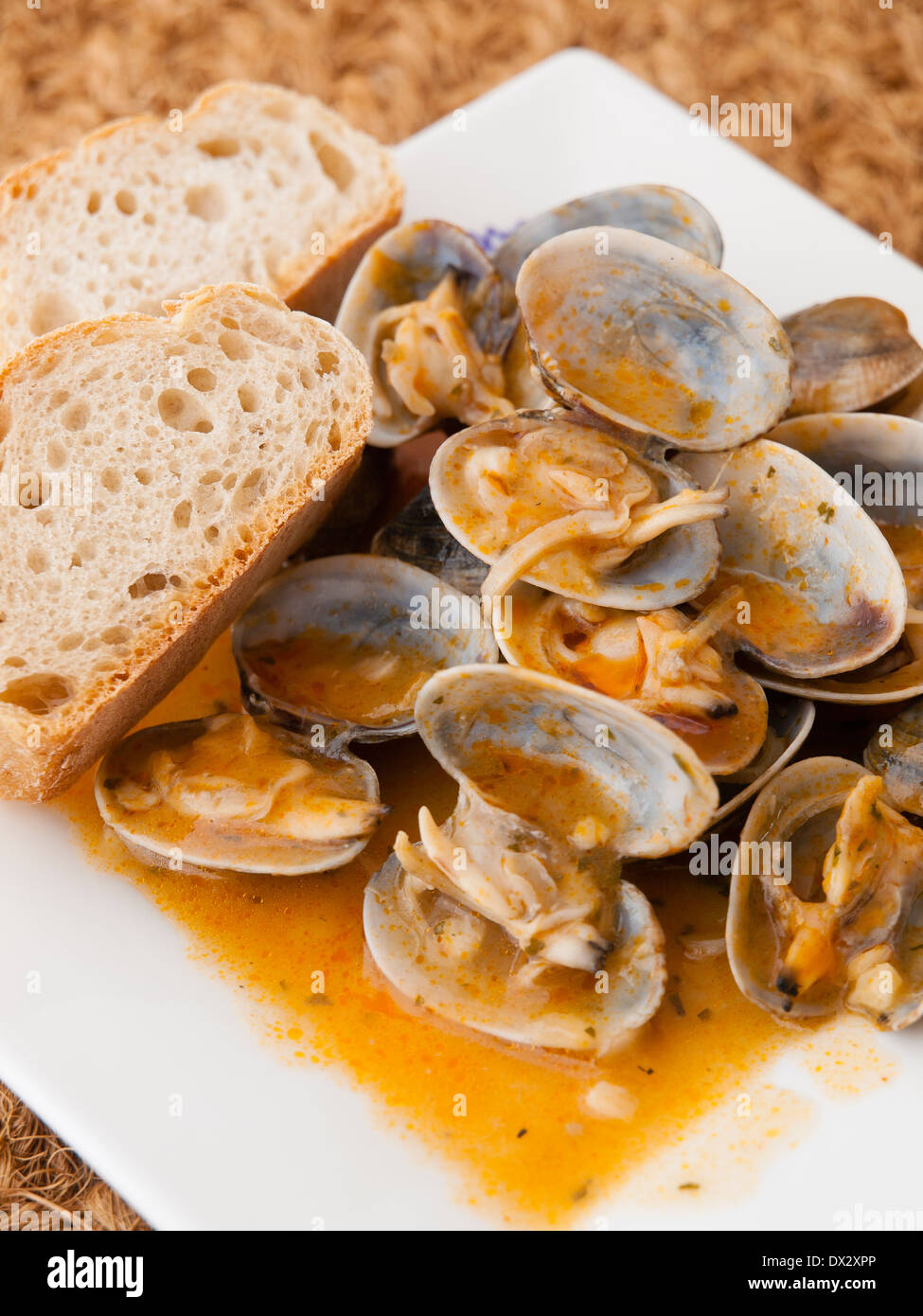 Clams cooked in the recipe "almejas a la marinera" background in a ...