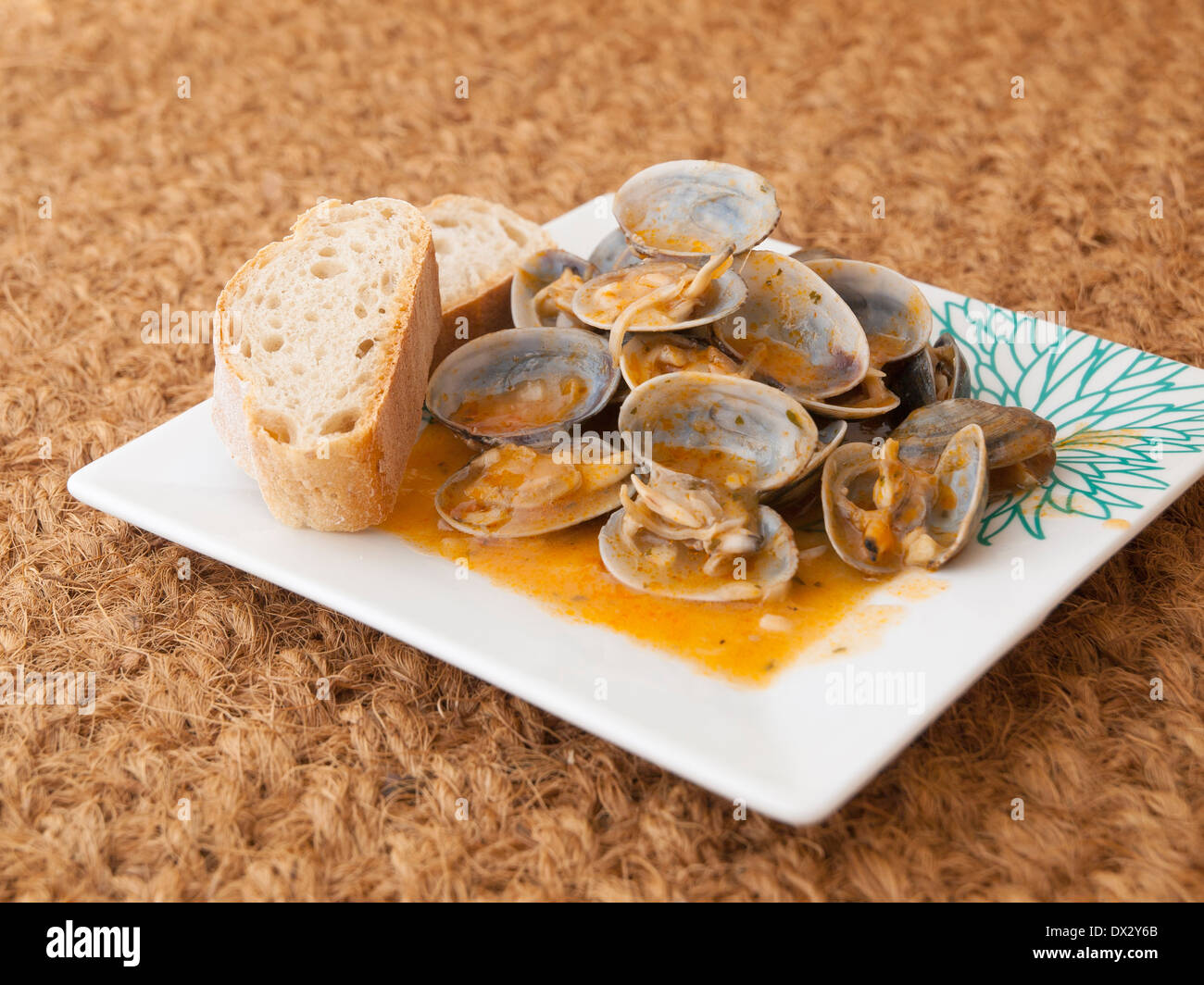 Clams cooked in the recipe "almejas a la marinera" background Stock ...