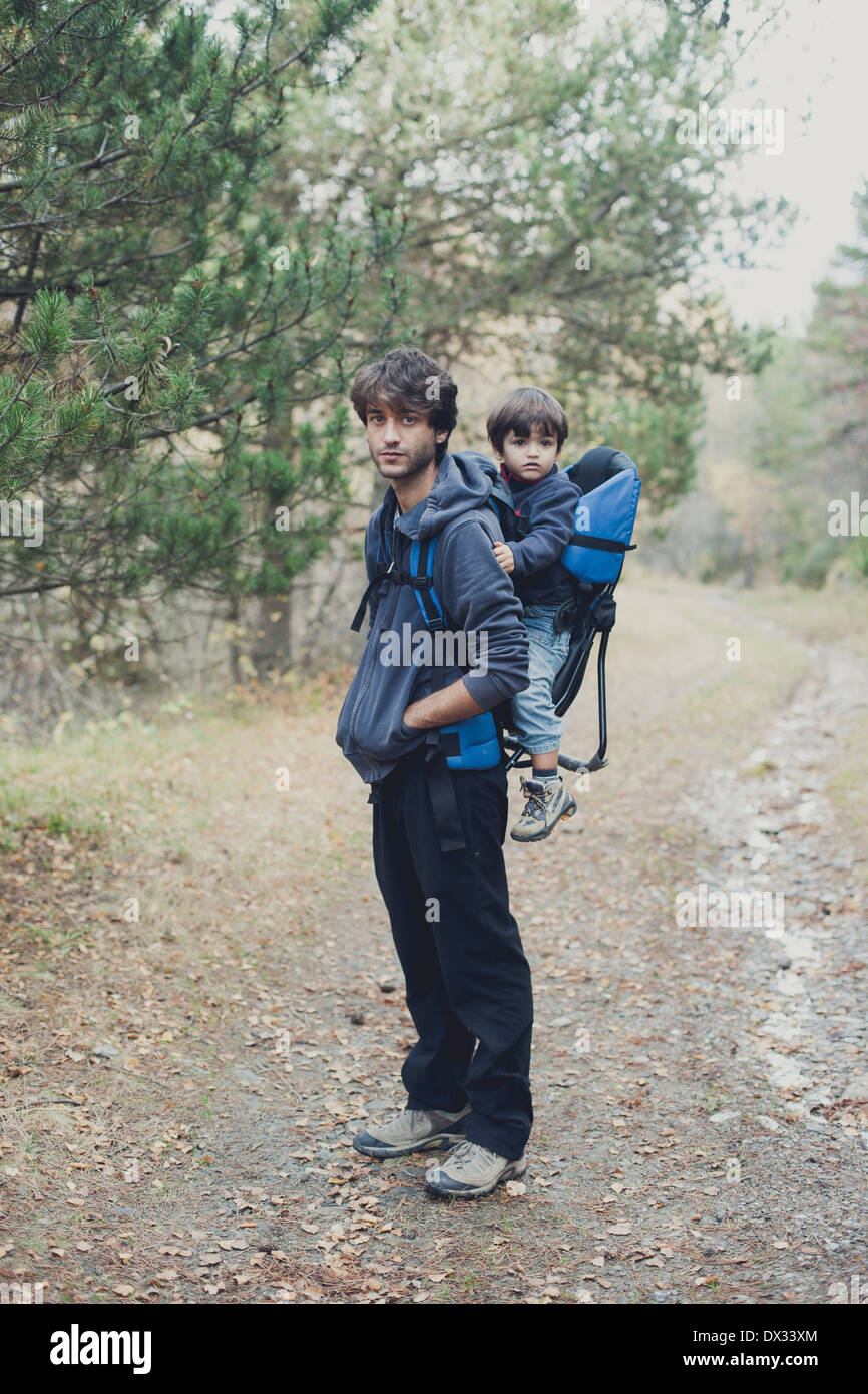 Thirty years old man carrying a two year old boy on his back Stock ...