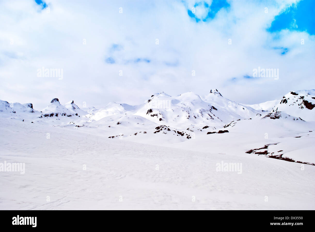 High mountain landscape with snow and small river in the Pyrenees Stock ...