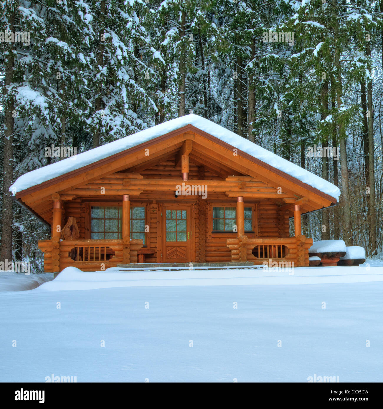 Wooden cottage in snowy forest in winter Stock Photo - Alamy