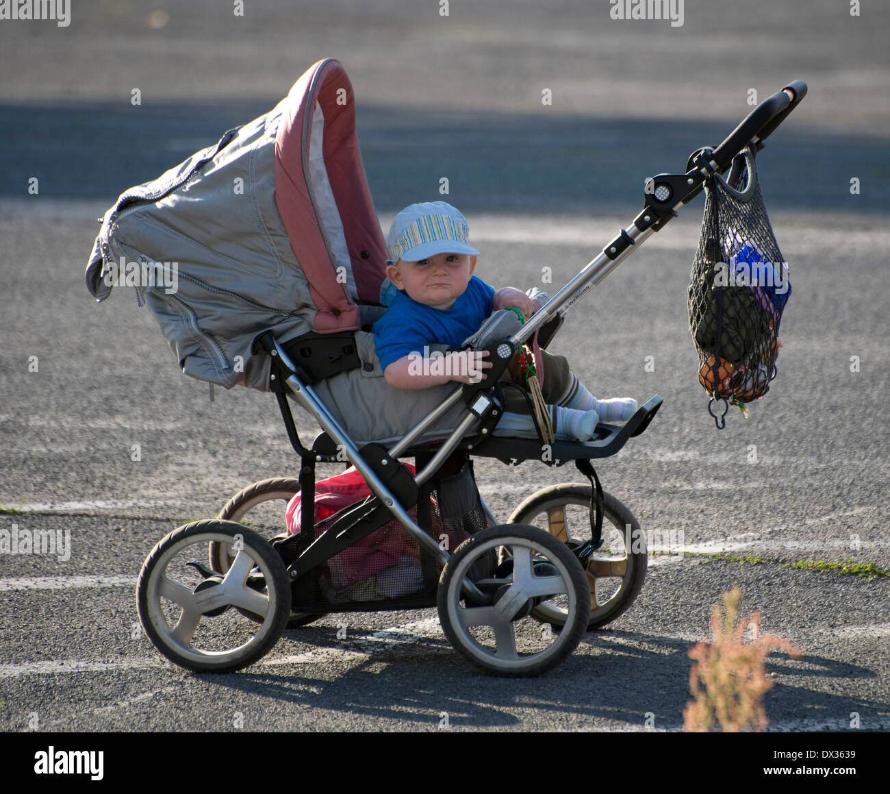 Baby in stroller Stock Photo - Alamy