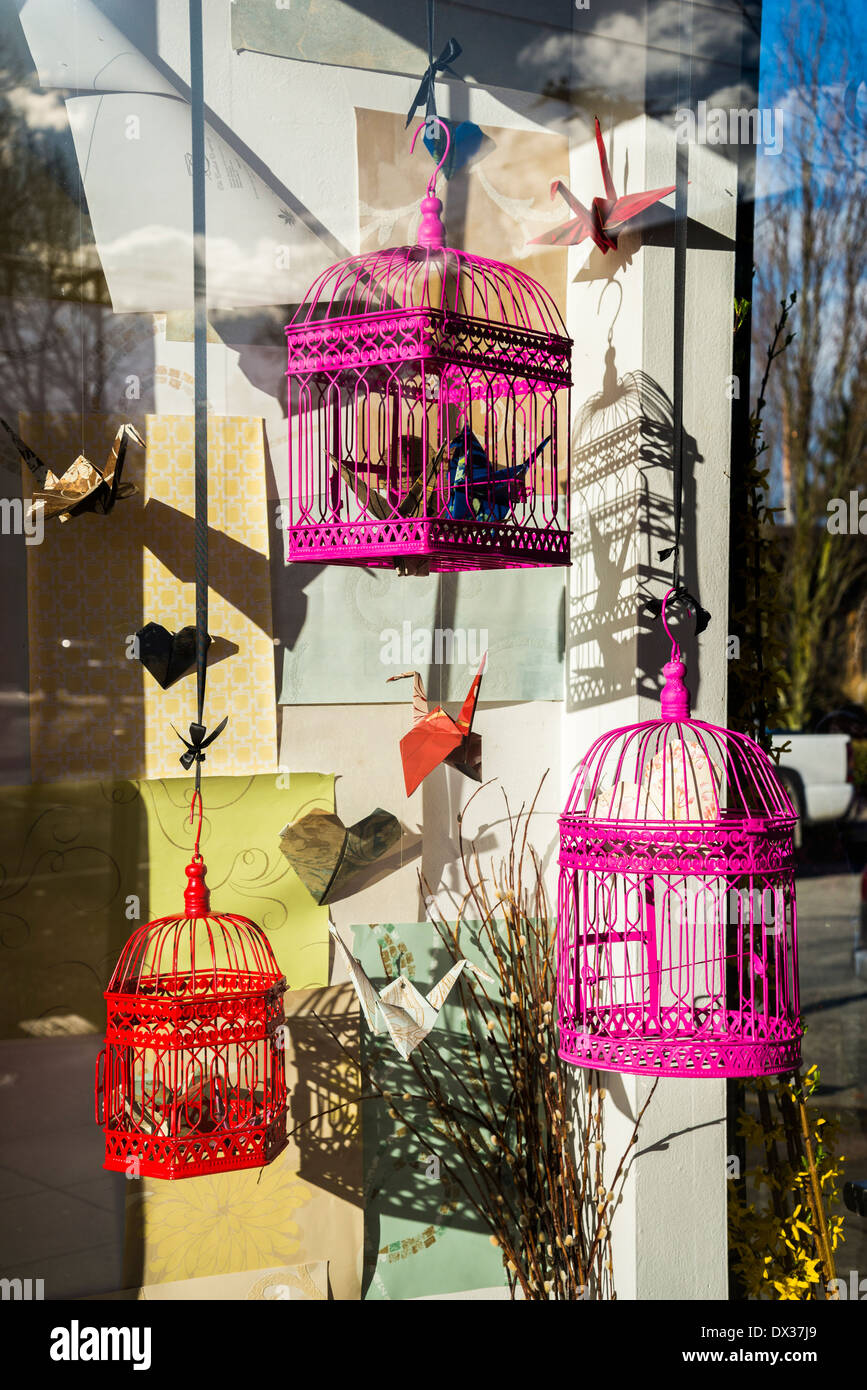 Birdcages in window Stock Photo - Alamy