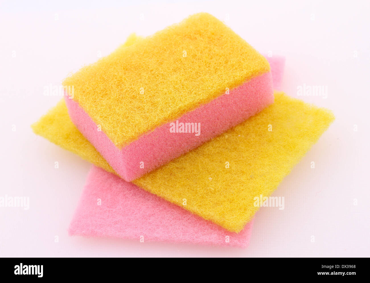 Yellow and pink sponges in different shapes Stock Photo - Alamy