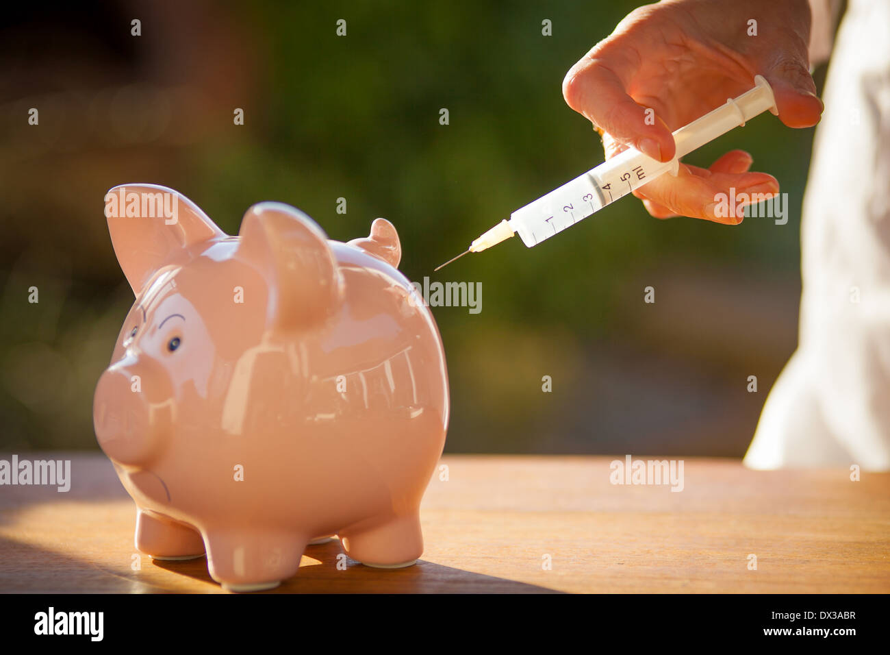 Money injection hi-res stock photography and images - Alamy