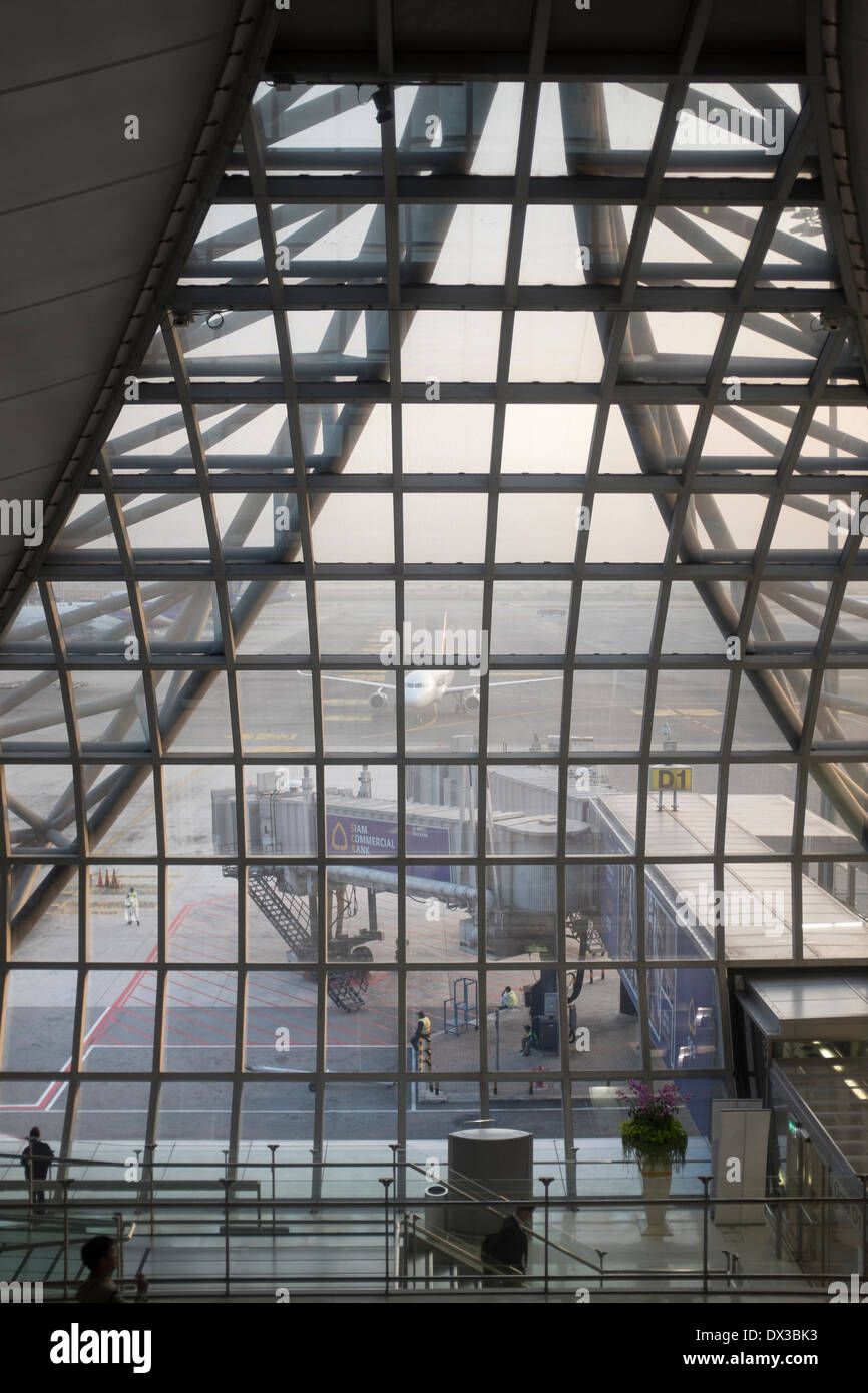 Plane arriving at Airport Terminal seen through the windows of the ...