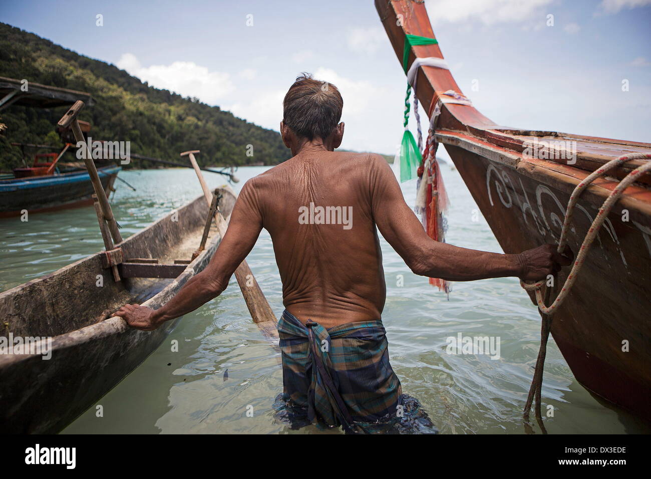 Ko Surin, Thailand. 11th Oct, 2013. An indigenous Moken man takes his ...