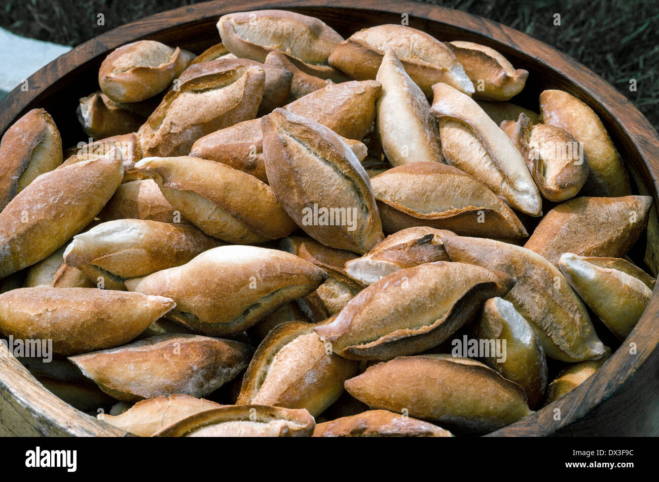 A wooden bowl is filled with tasty bolillos, the popular and ...