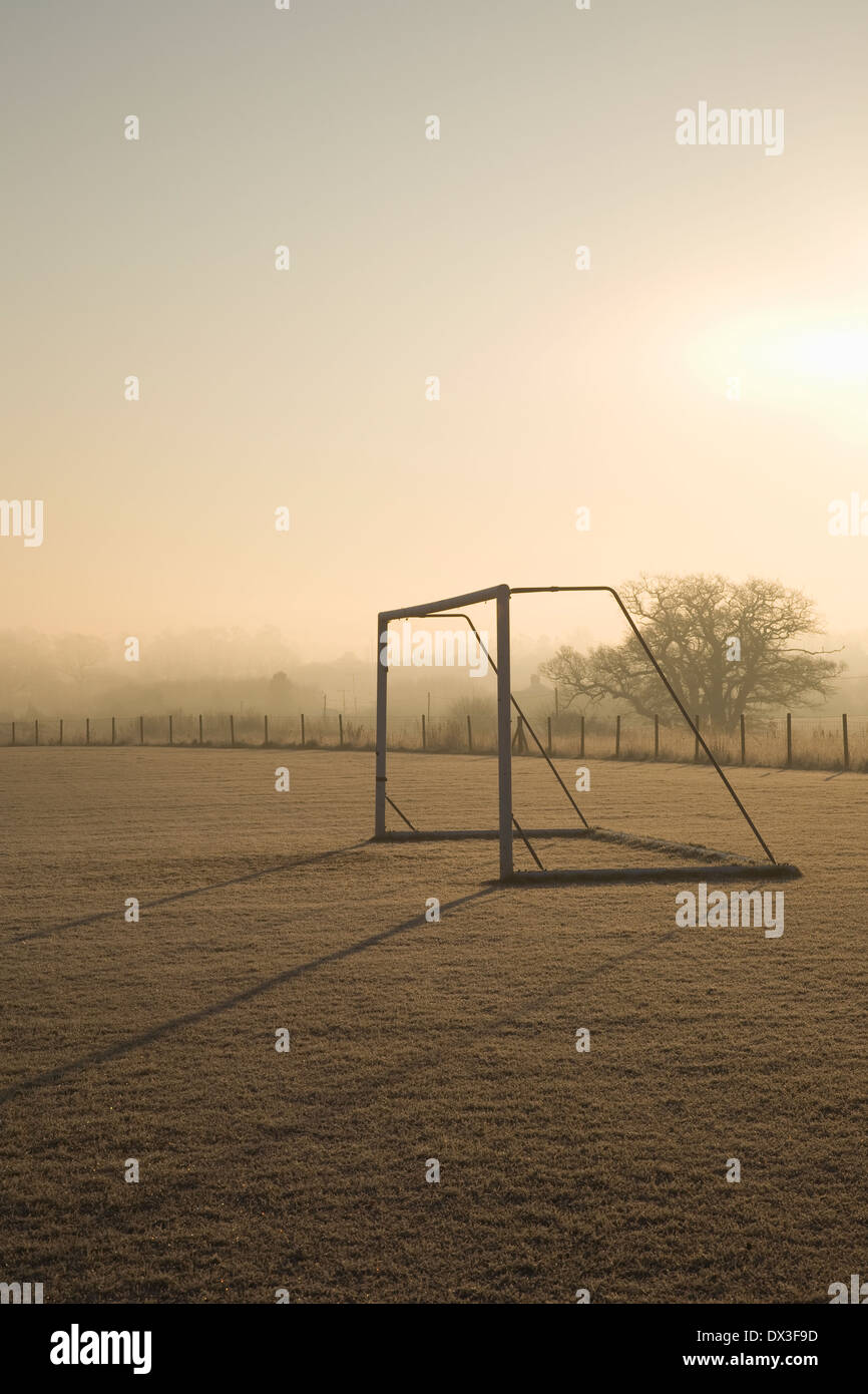 empty football pitch and goal on a frosty winter morning sunrise Stock ...