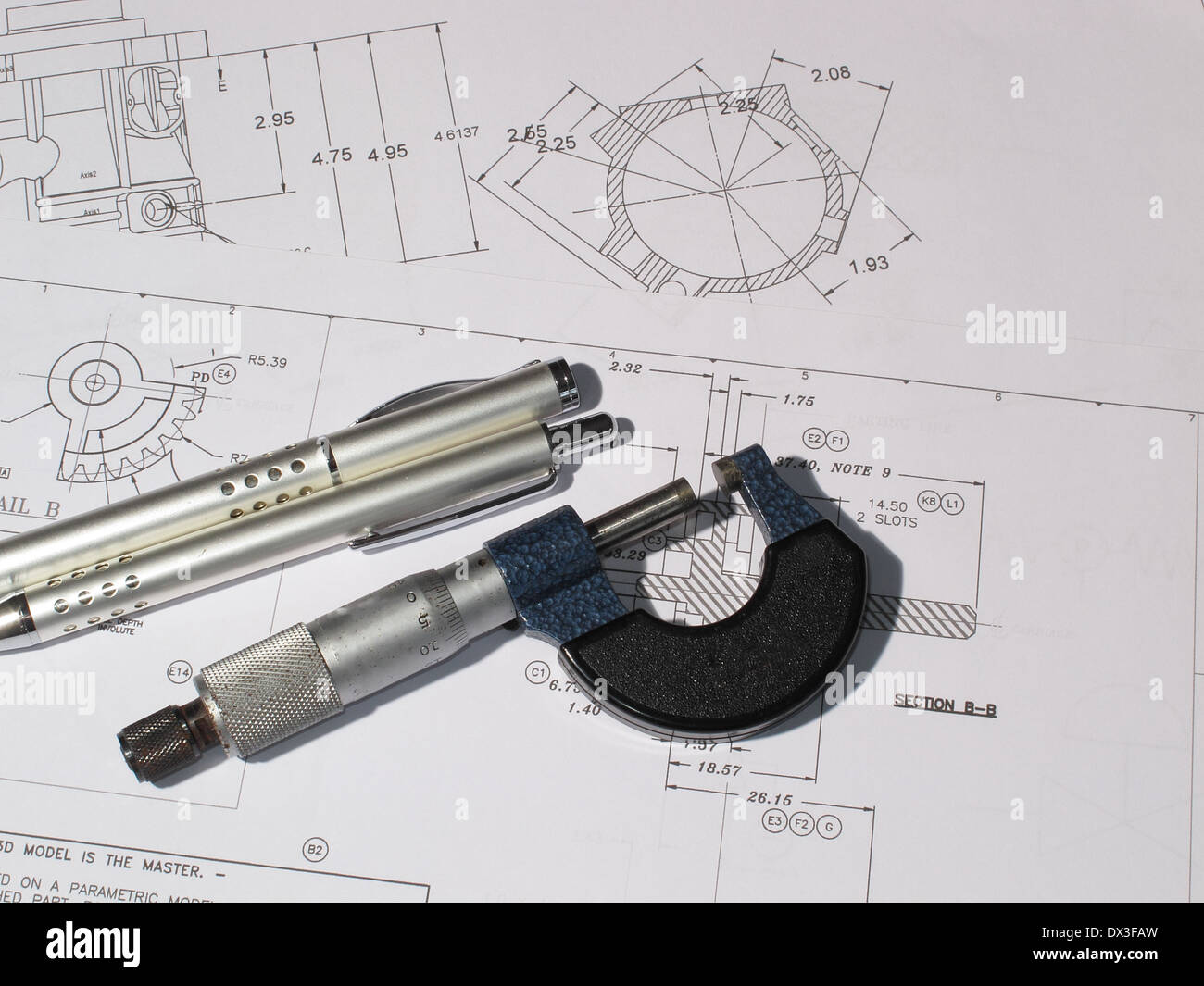 An image showing Pens, and a micrometer for precision measurements ...