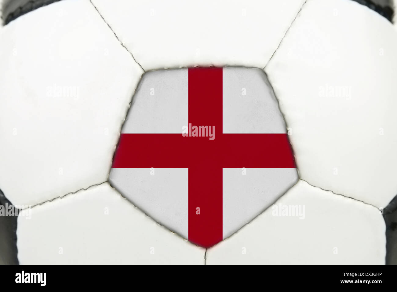 close up shot of a black and white leather football showing the St ...