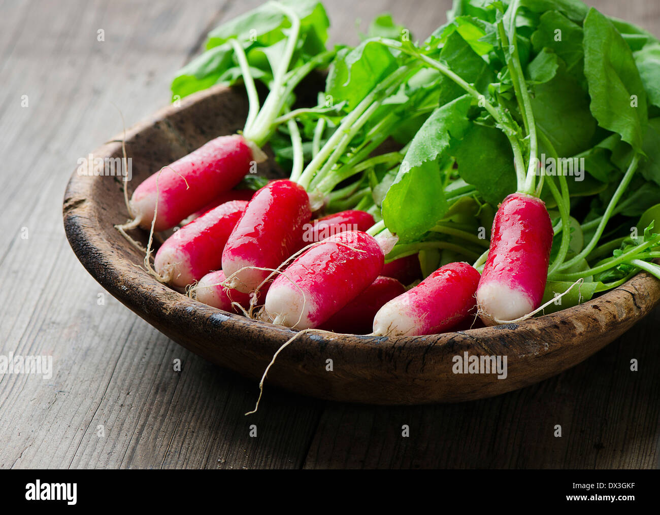 Fresh radishes on a wooden board Stock Photo - Alamy