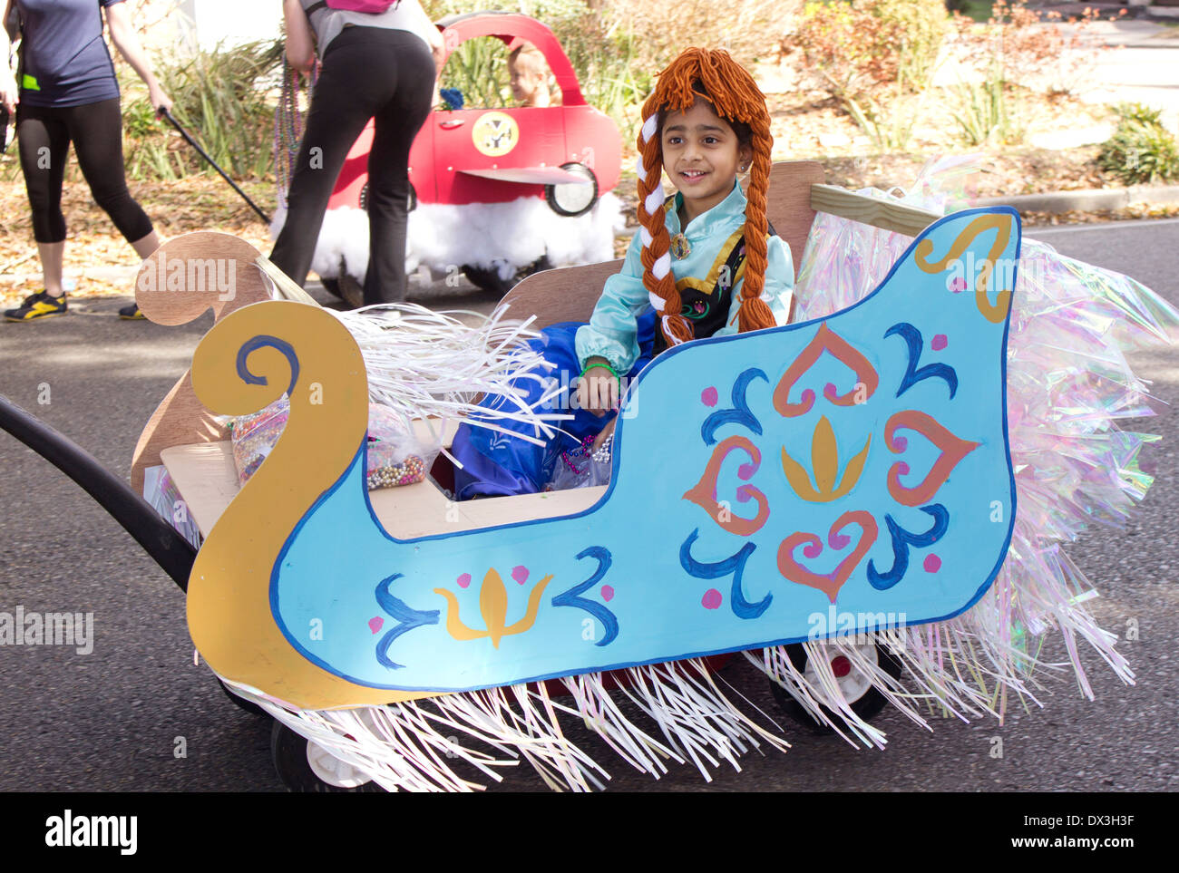 Young child participating in an elementary school parade during Mardi ...