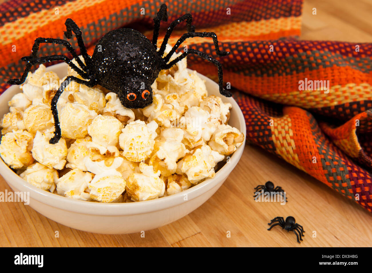 Dish of popcorn with Halloween spiders Stock Photo - Alamy