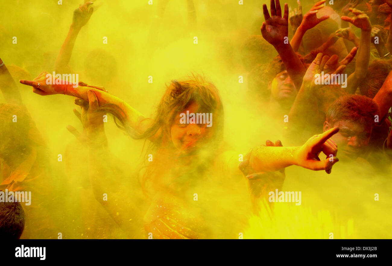 Guwahati, India. 17th Mar, 2014. People celebrate the Holi festival in ...