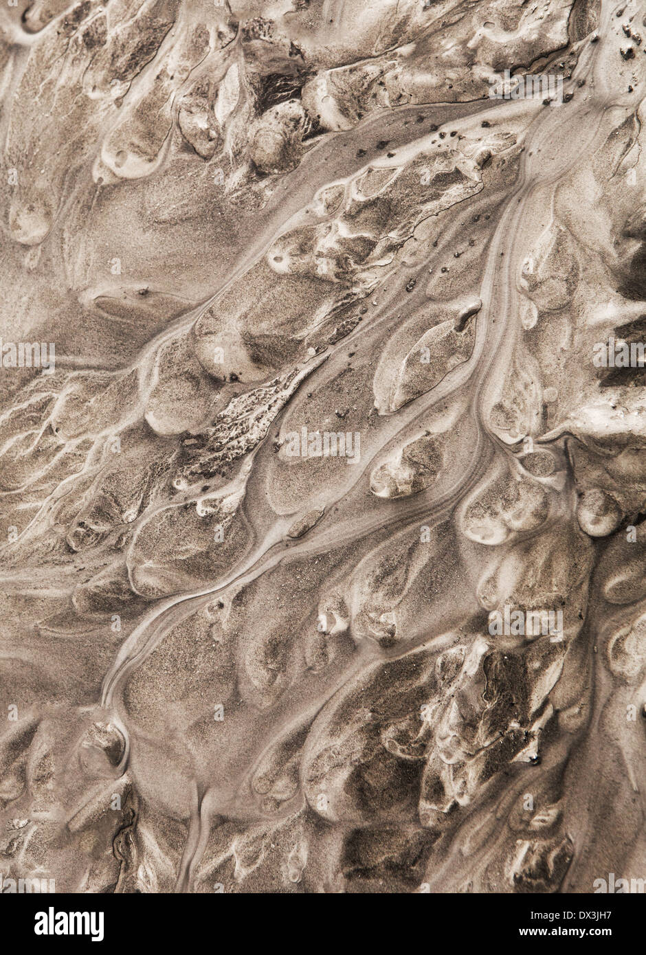 Patterns in glacial silt from a melting glacier in Alaska Stock Photo ...