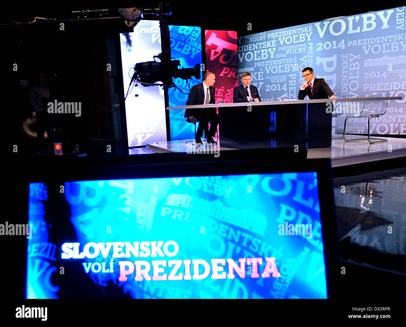 Candidates Robert Fico, center, and Andrej Kiska, left, attend a ...