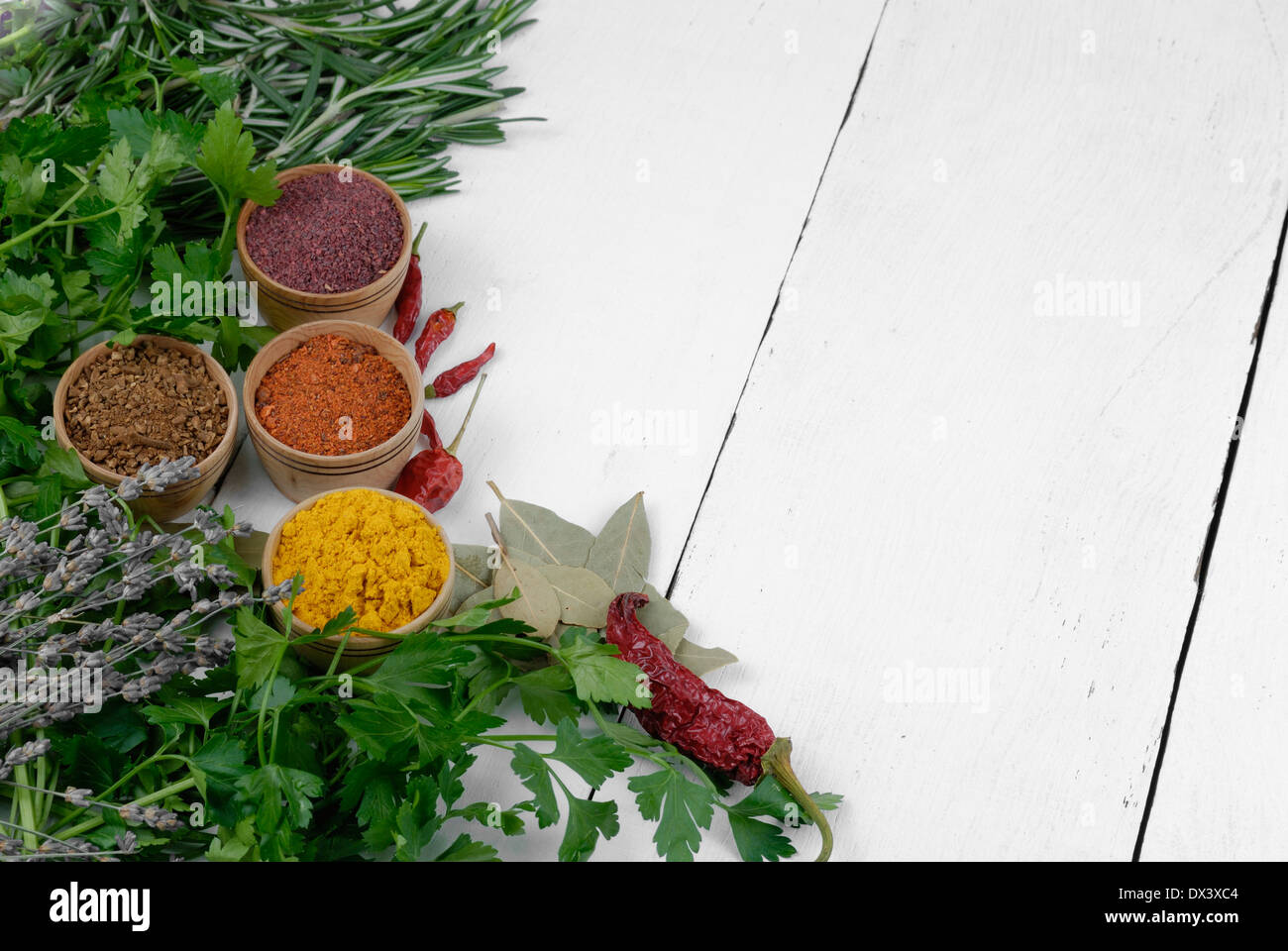 Different kinds of seasonings and herbs on the white oak table Stock ...