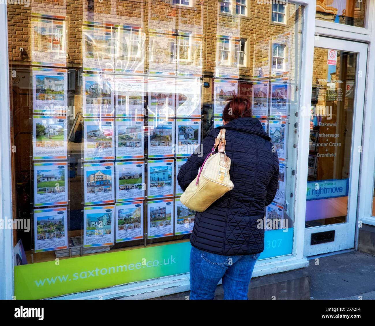 Woman standing estate agent hi-res stock photography and images - Alamy
