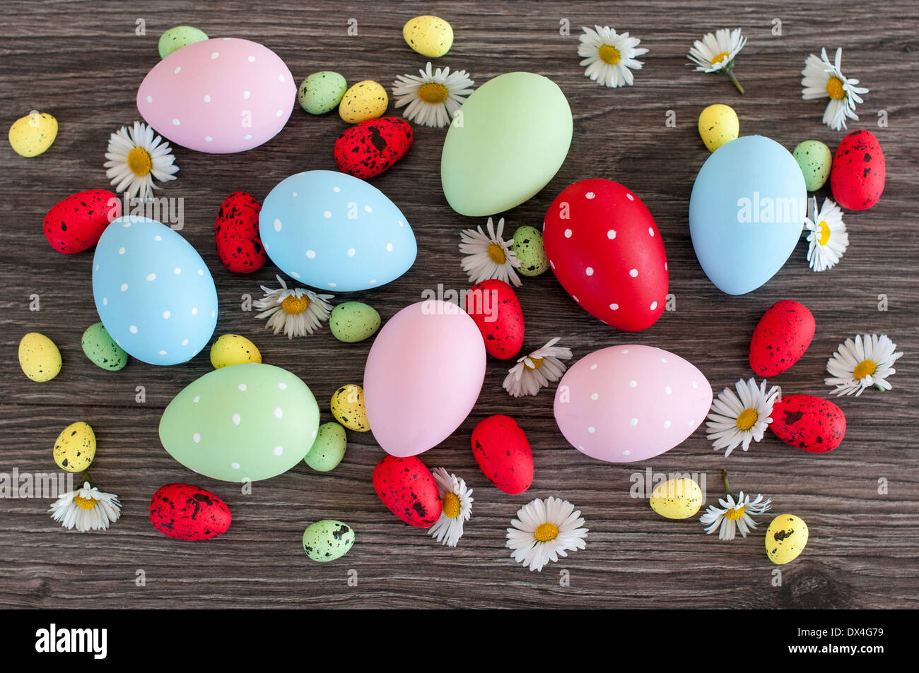 Different color Easter egg on an old wood Stock Photo - Alamy
