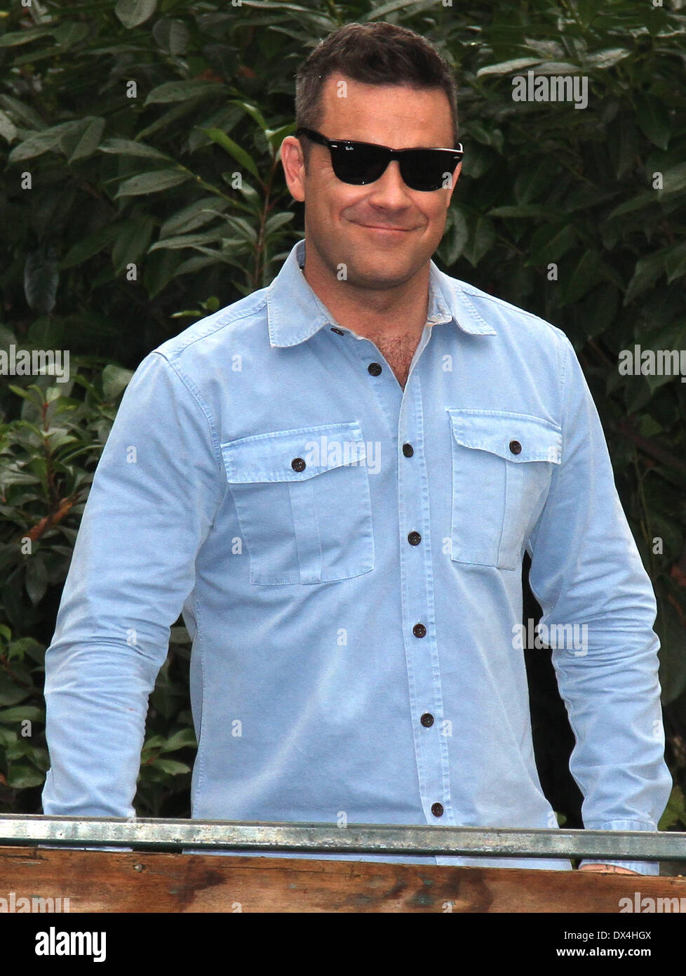 Robbie Williams arrives at a television studio for a recording of ...