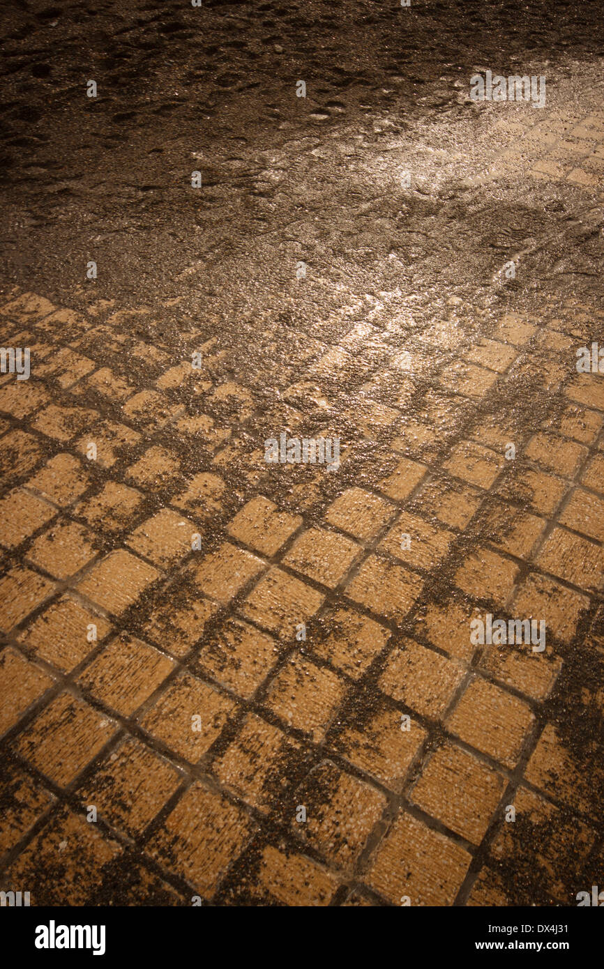 Pavement filled with sand after the heavy storms battered the ...