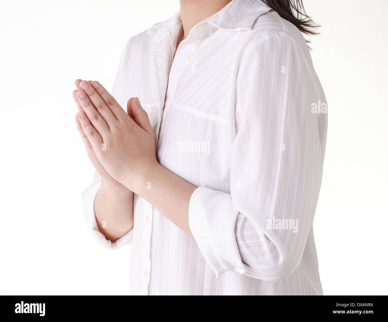 Woman praying isolated on white background Stock Photo - Alamy
