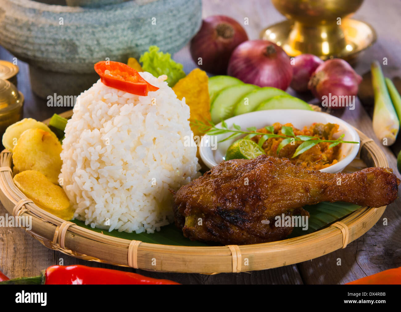 indonesian fried chicken rice on traditional background Stock Photo - Alamy