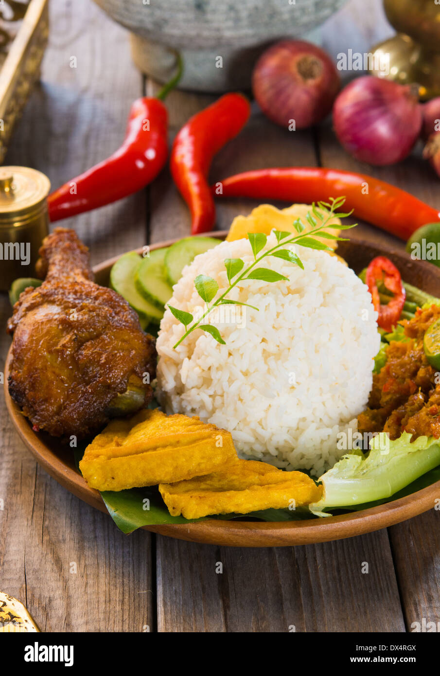 indonesian fried chicken rice on traditional background Stock Photo - Alamy