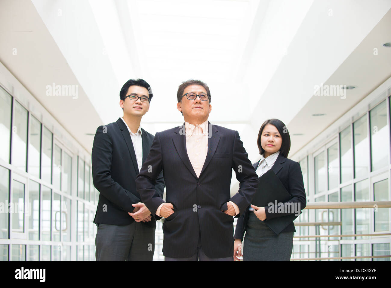asian business team in office background Stock Photo - Alamy
