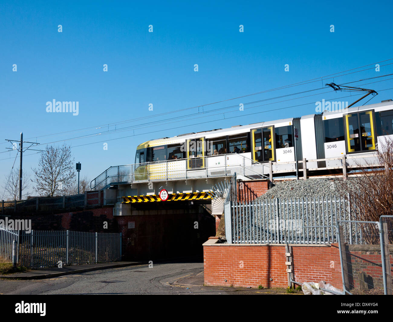 Metrolink Tram going over bridge, Chadderton, Oldham, Greater ...