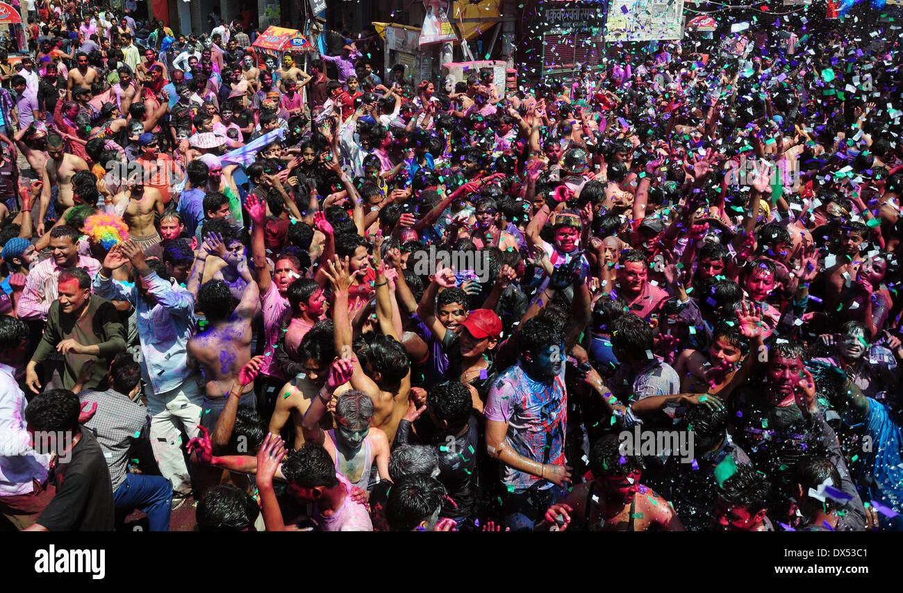 Allahabad, India. 18 March 2014. Indian revellers covered in coloured ...
