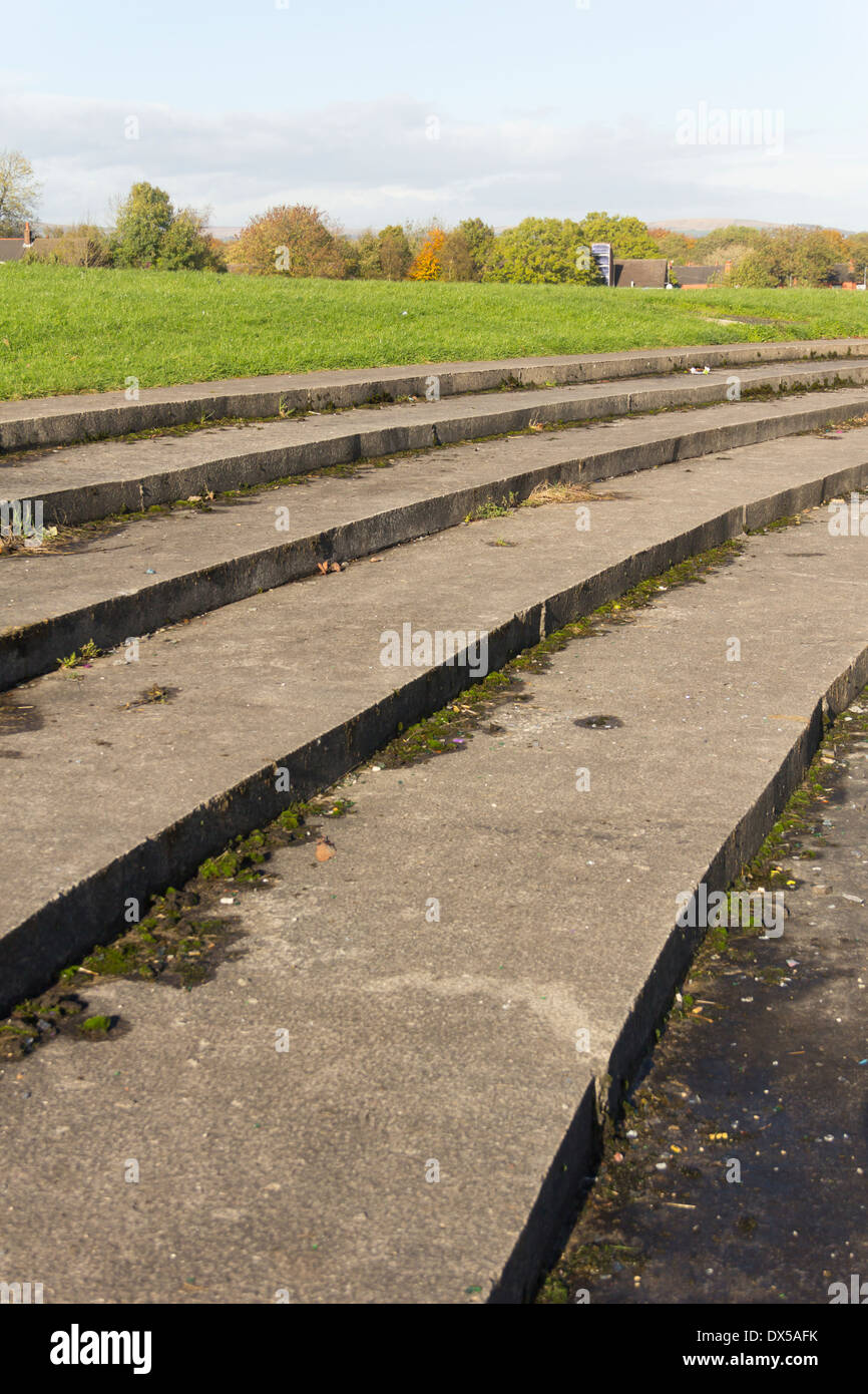 Shallow terraced steps for spectators by the disused running track at ...