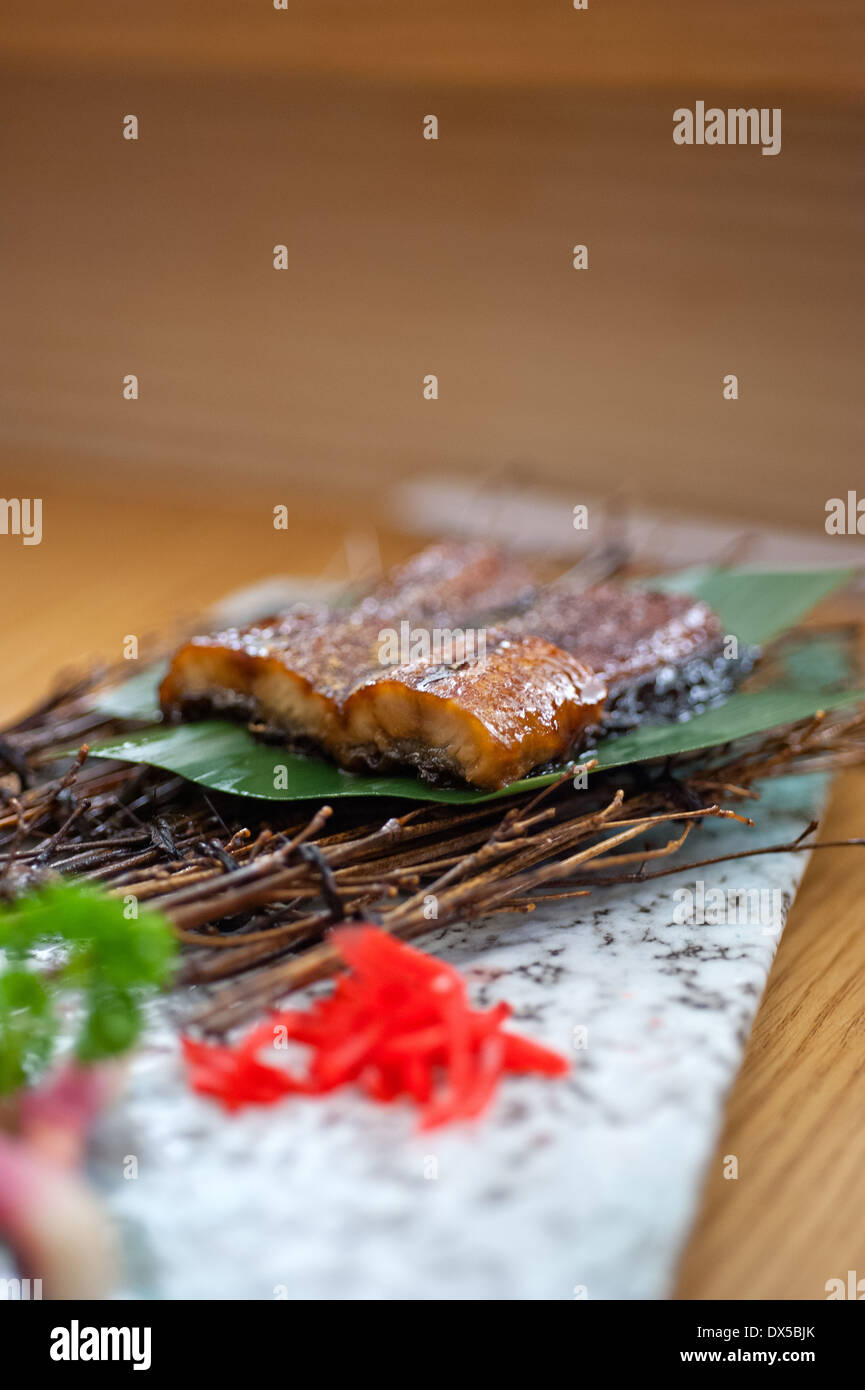 Japanese style roasted eel served on palm leaf Stock Photo - Alamy