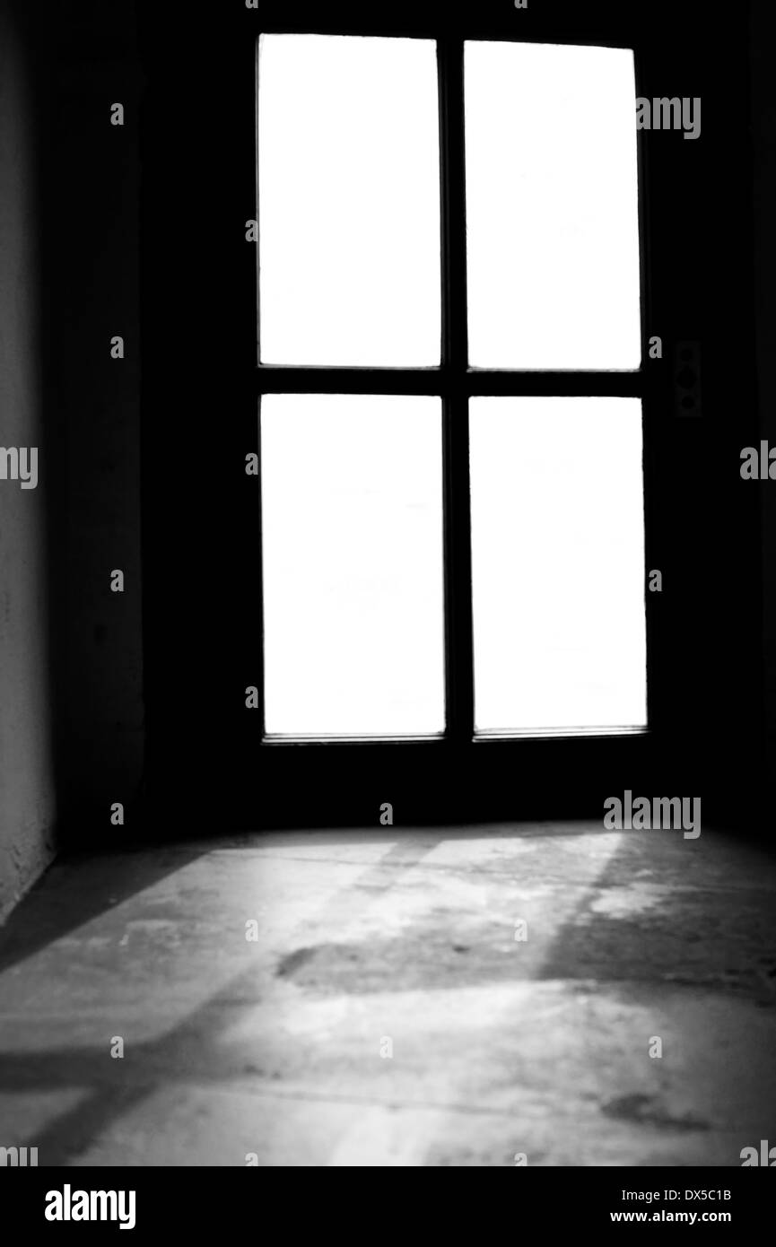 Light reaching the basement window Stock Photo - Alamy