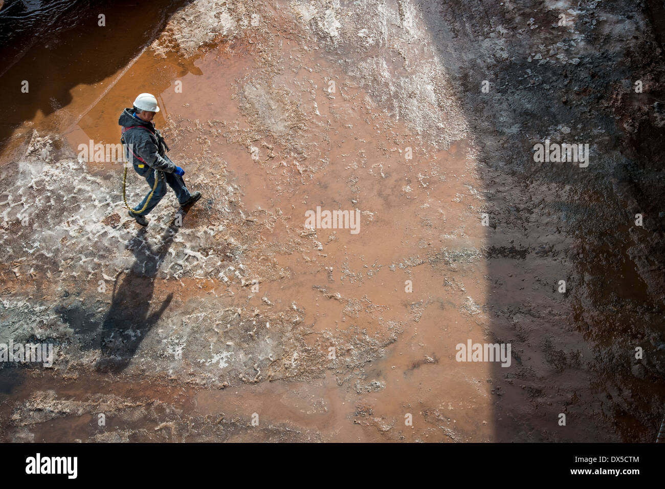 Aerial View Of Construction Worker At Muddy Snowy Construction Site ...
