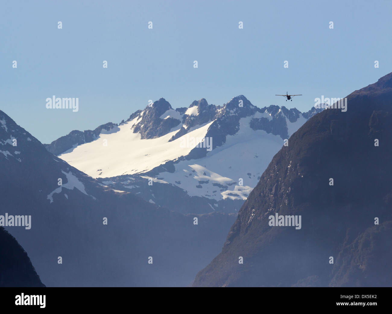 BN-2 Islander plane flying into Milford Sound on South Island of New ...