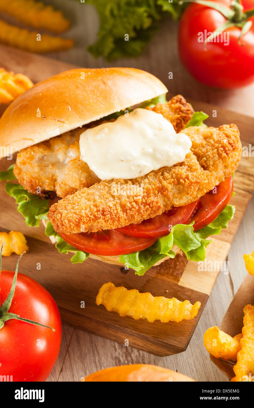 Breaded Fish Sandwich with Tartar Sauce and Fries Stock Photo - Alamy