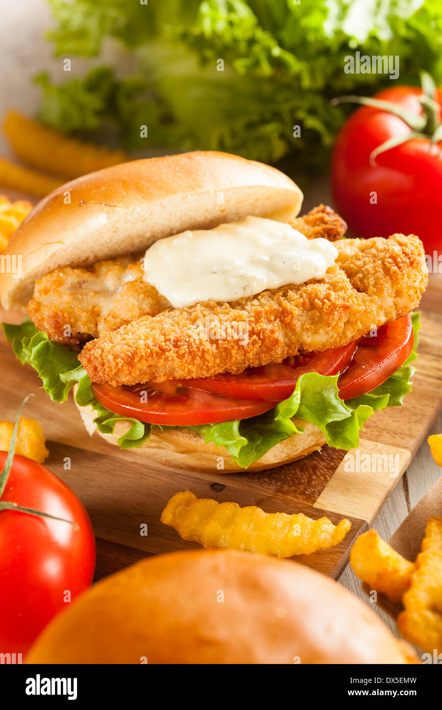 Breaded Fish Sandwich with Tartar Sauce and Fries Stock Photo - Alamy