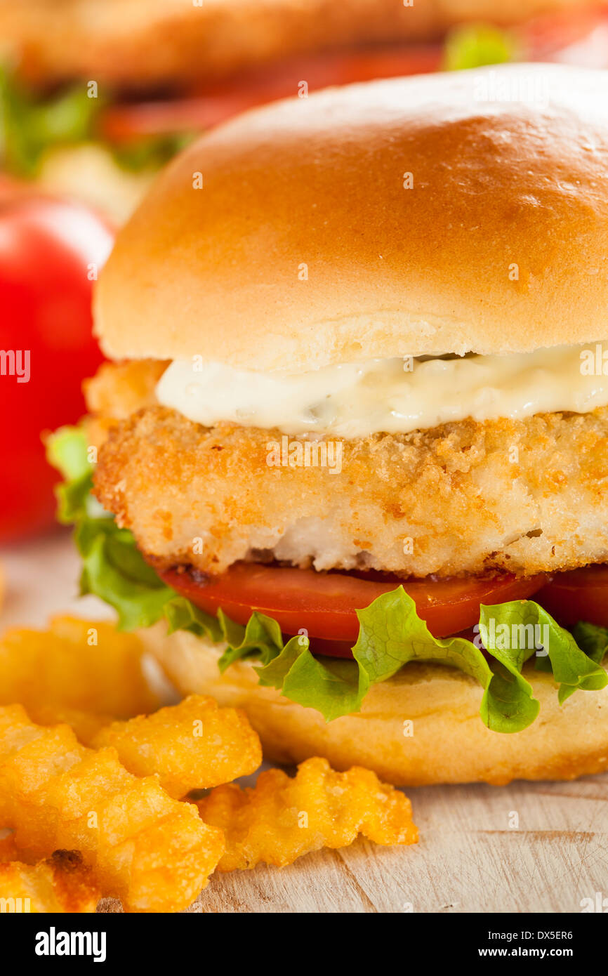 Breaded Fish Sandwich with Tartar Sauce and Fries Stock Photo - Alamy