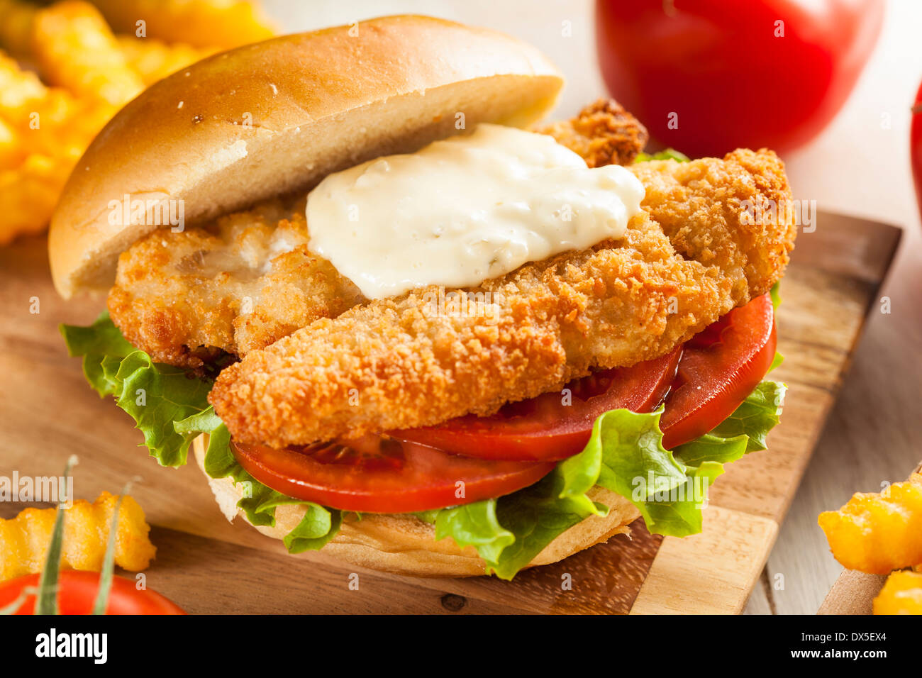 Breaded Fish Sandwich with Tartar Sauce and Fries Stock Photo - Alamy