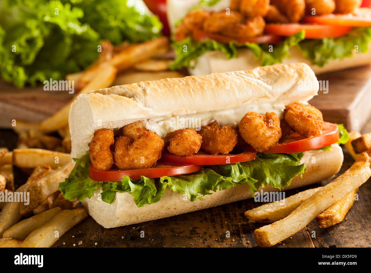 Homemade Shrimp Po Boy Sandwich with French Fries Stock Photo - Alamy