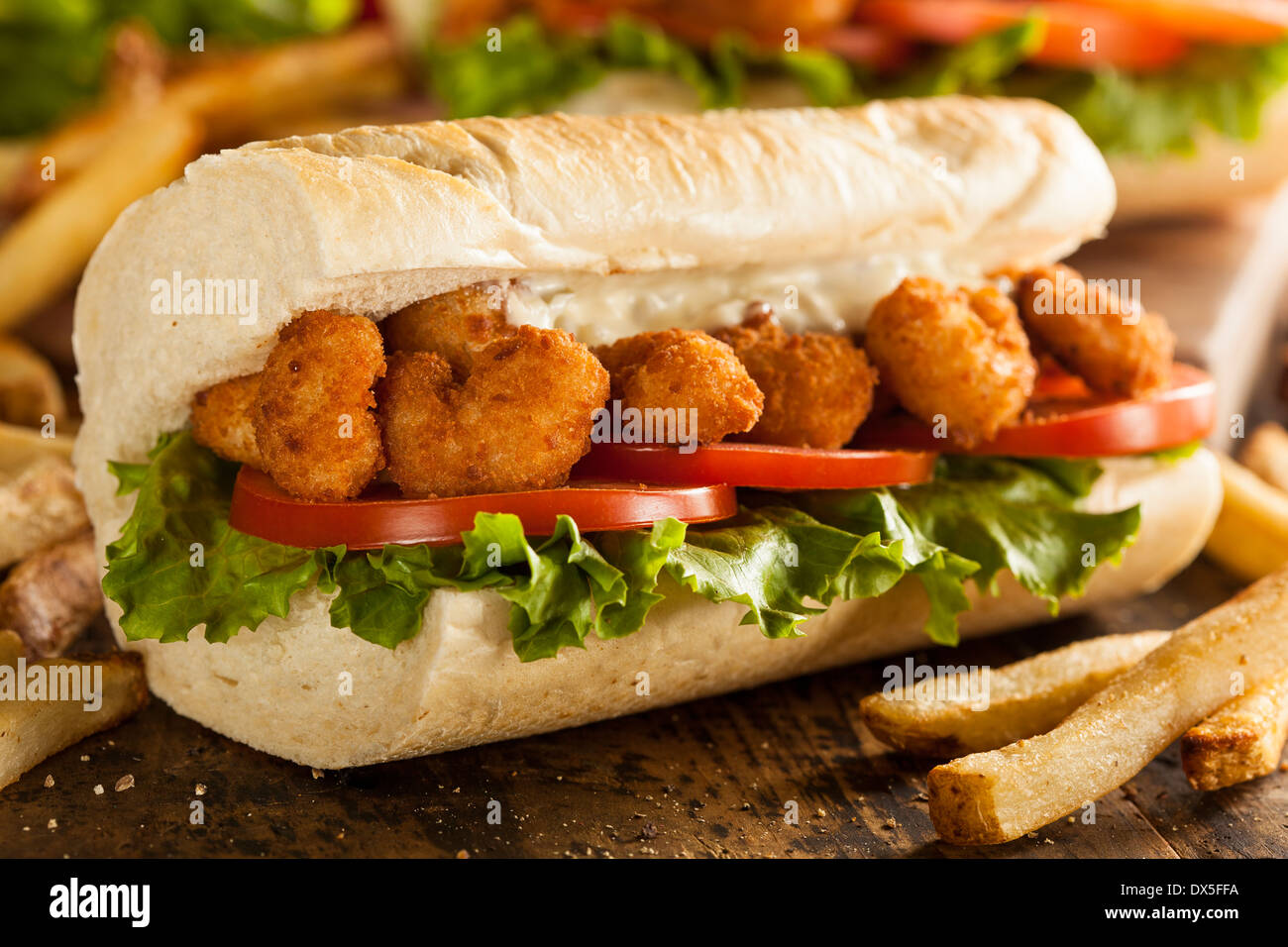 Homemade Shrimp Po Boy Sandwich with French Fries Stock Photo - Alamy